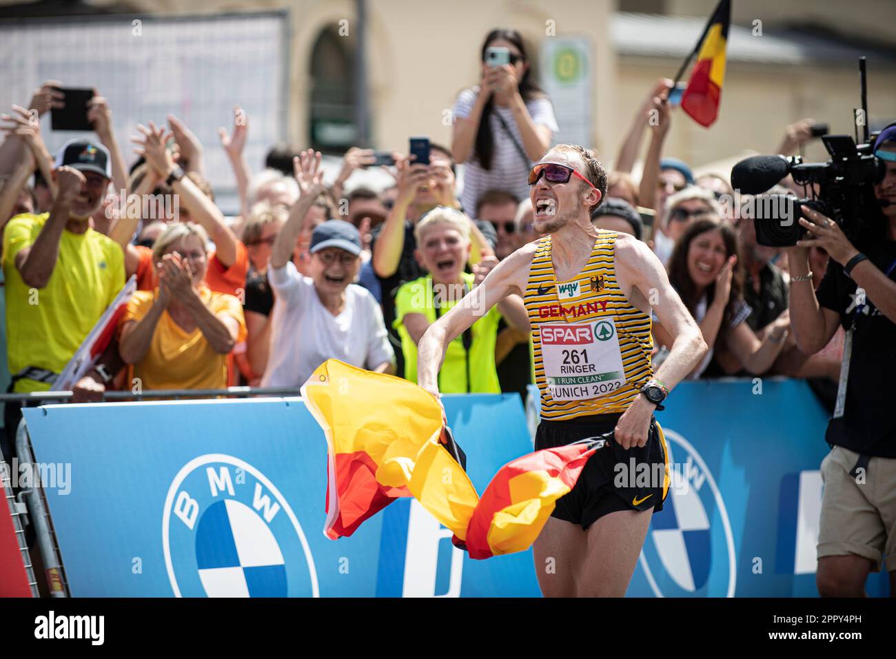 Richard Ringer with his country's flag celebrating his victory in the ...