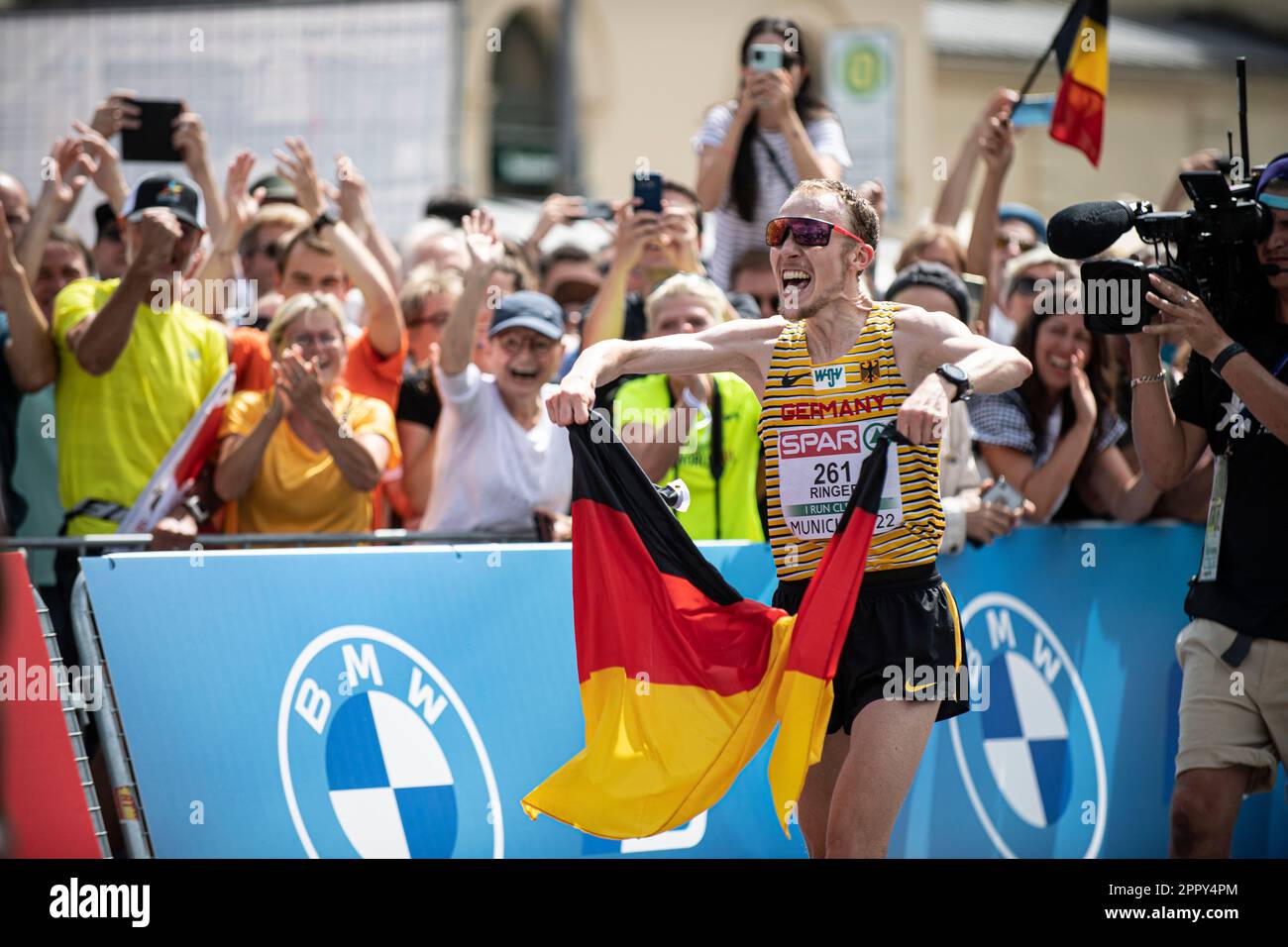 Richard Ringer with his country's flag celebrating his victory in the ...