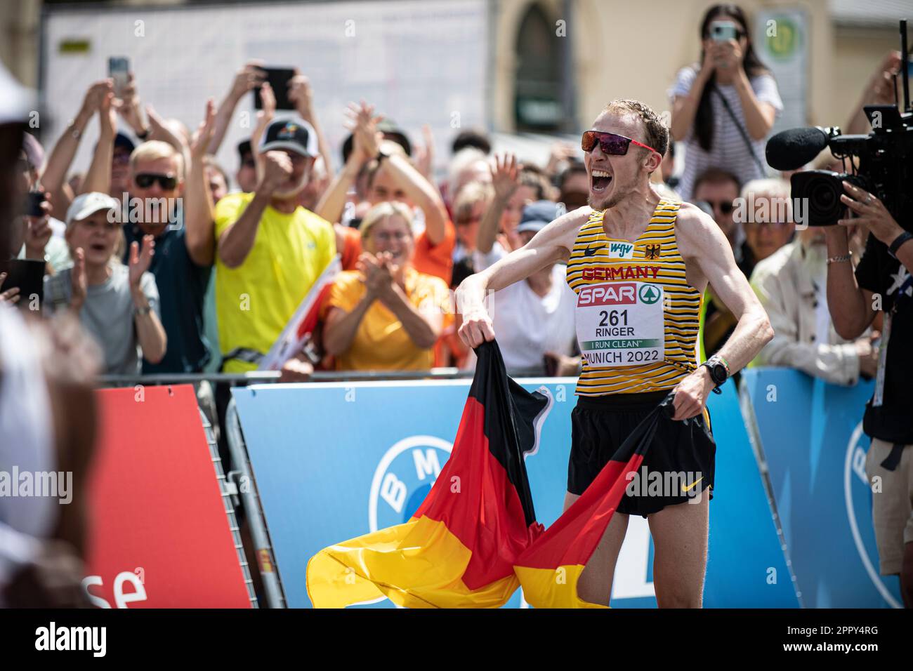Richard Ringer with his country's flag celebrating his victory in the ...