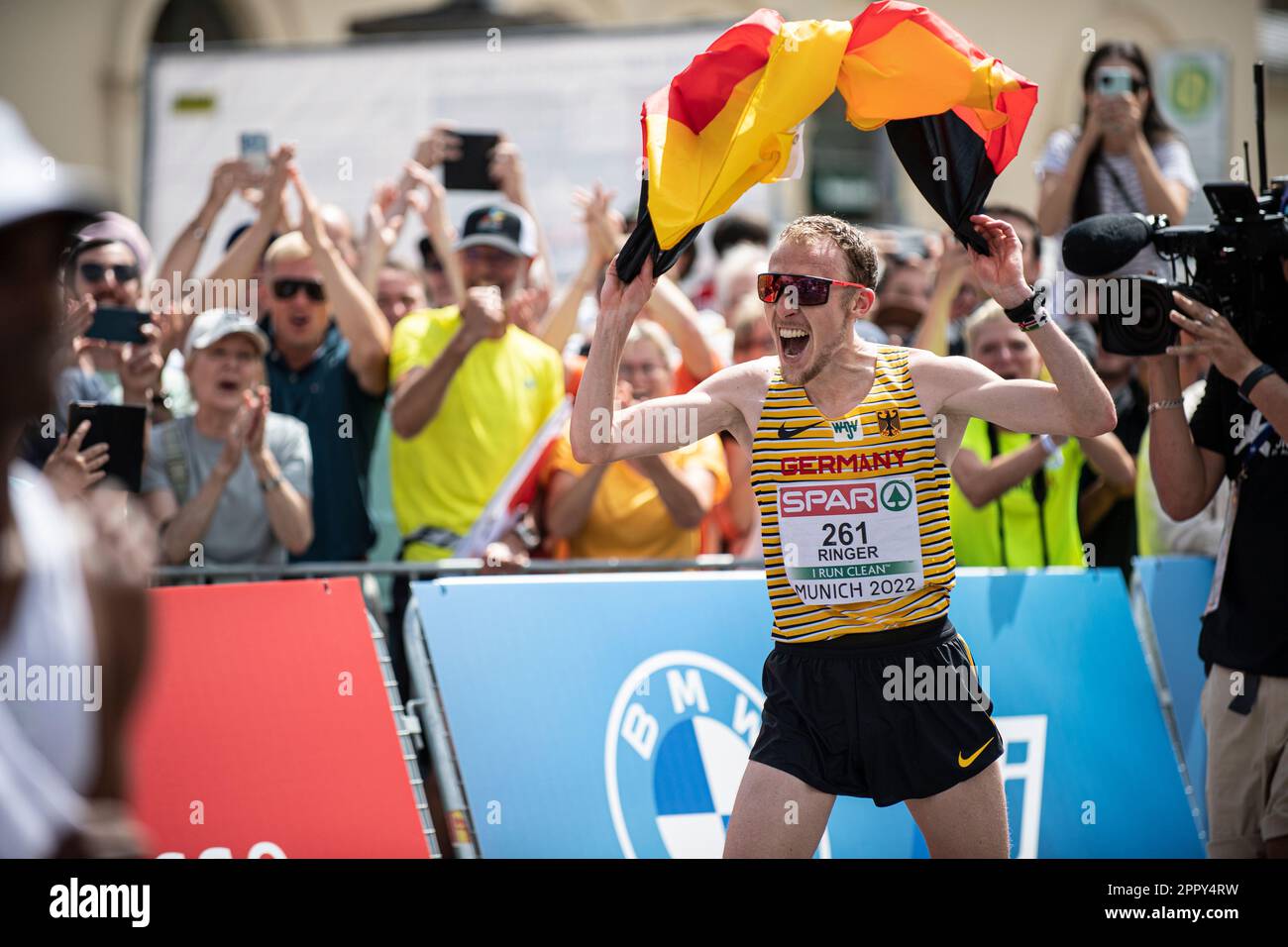 Richard Ringer with his country's flag celebrating his victory in the ...