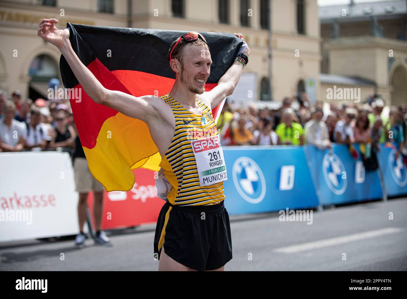 Richard Ringer with his country's flag celebrating his victory in the ...