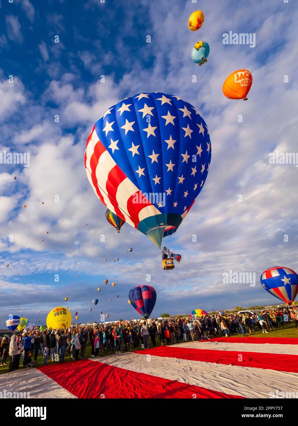 Crowd watching the hot air balloon liftoff of the Stars and Strips ...