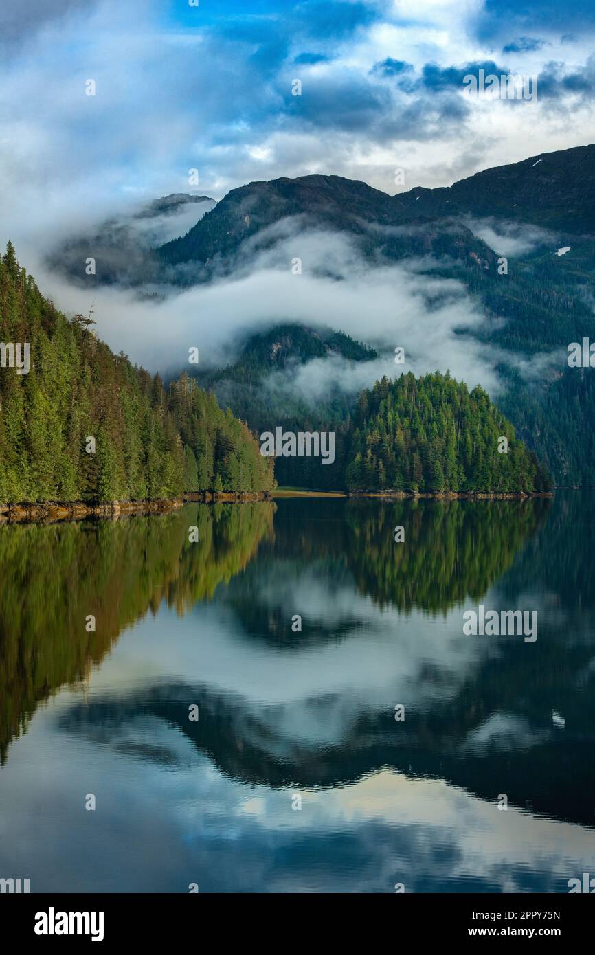 Fog rolling through mountain and over lake in Misty Fjords National ...