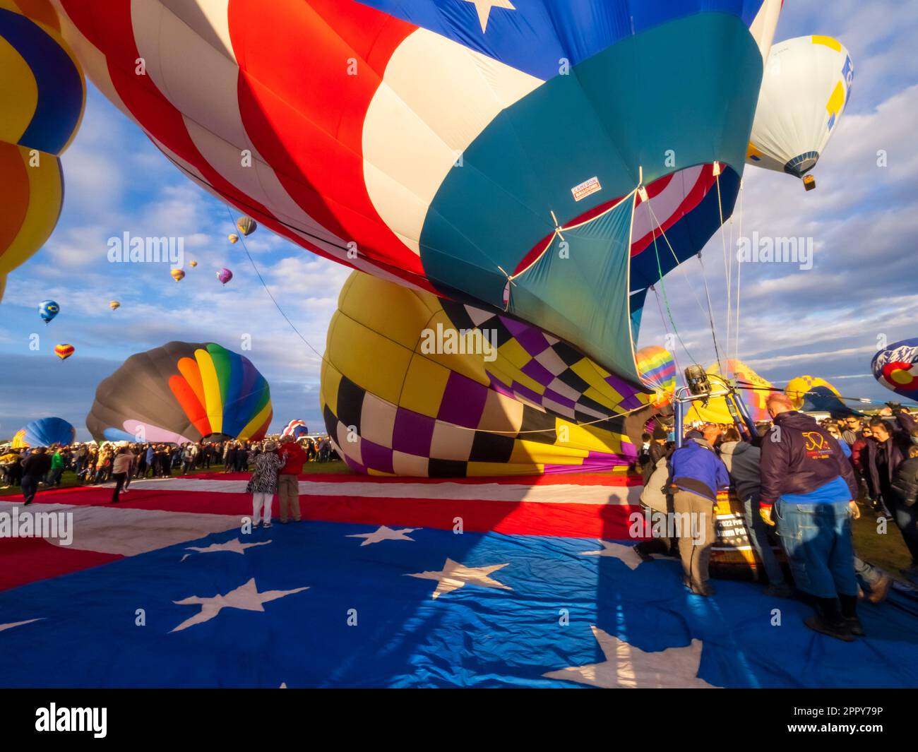 Crowd of people watching Stars and Stripes hot air balloon, Mass ...