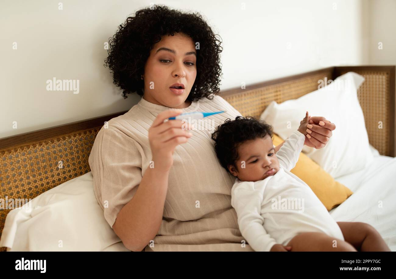 Worried sad shocked young african american mother with small child ...