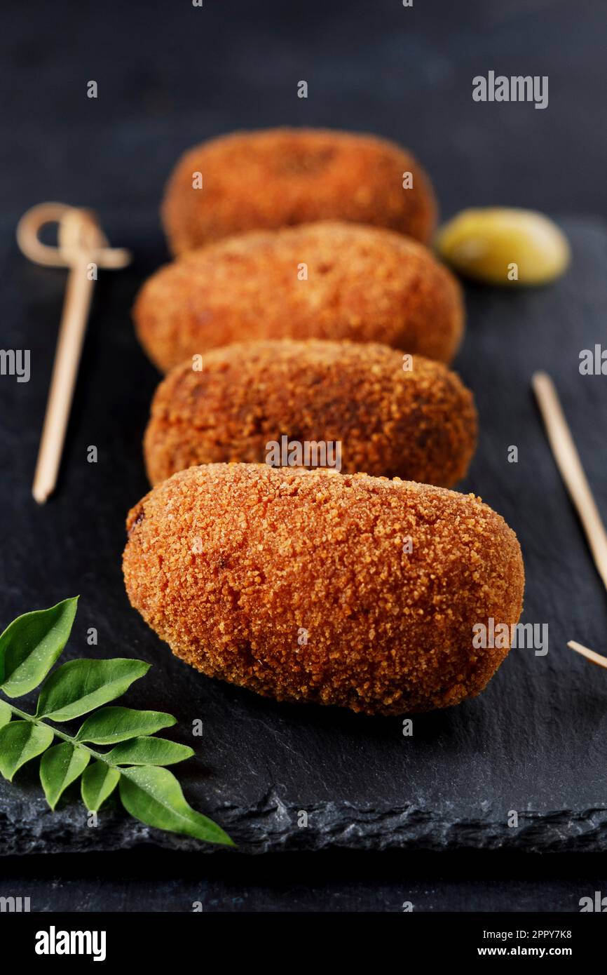 Portrait of gourmet style ham croquettes with black background Stock ...