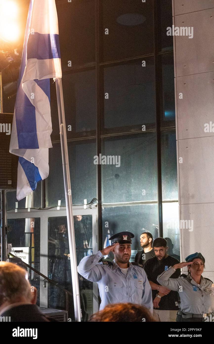 Harish, Israel. A Israeli officer salutesduring a memorial day service ...
