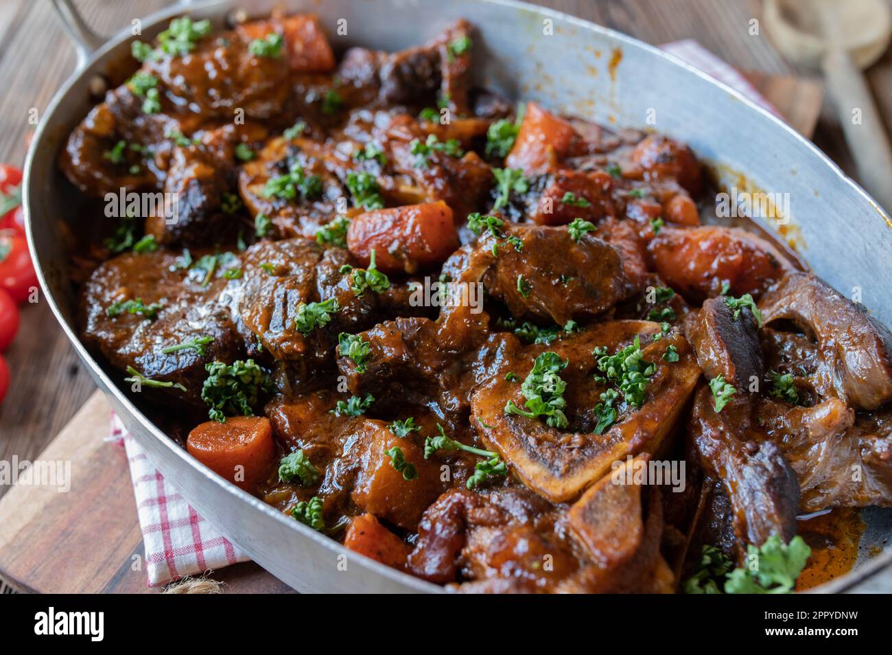 Osso bucco or osso buco, braised beef shanks in old fashioned roasting ...