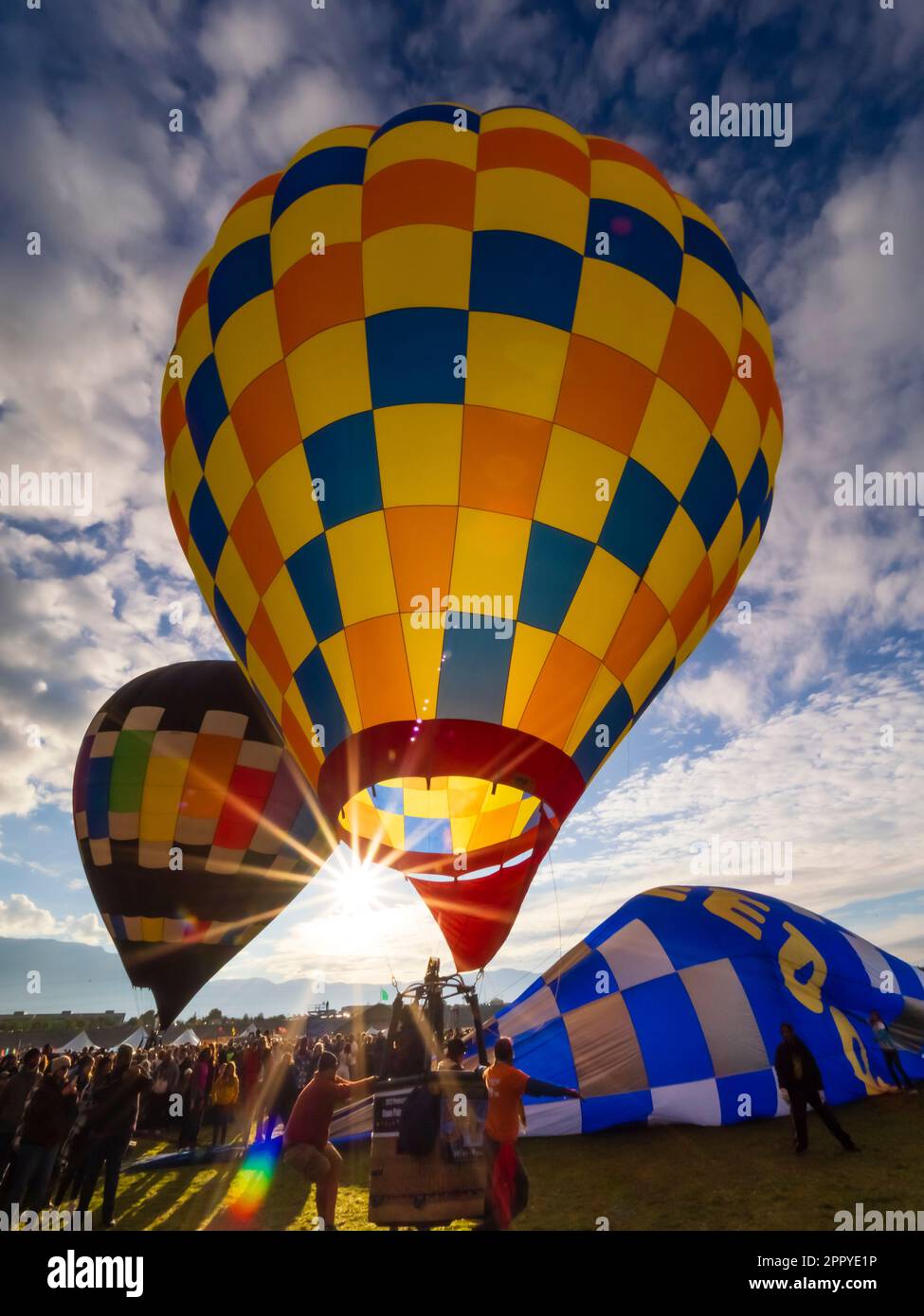 Ground level view of a hot air balloon lifting off at Sunrise ...