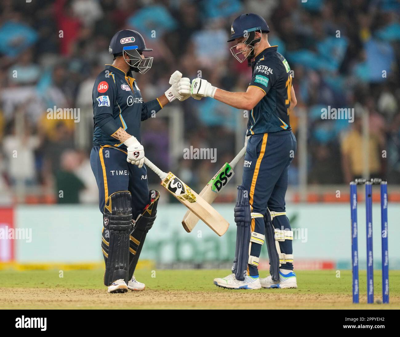 Gujarat Titan's Rahul Tewatia, left, fist bumps with his batting ...