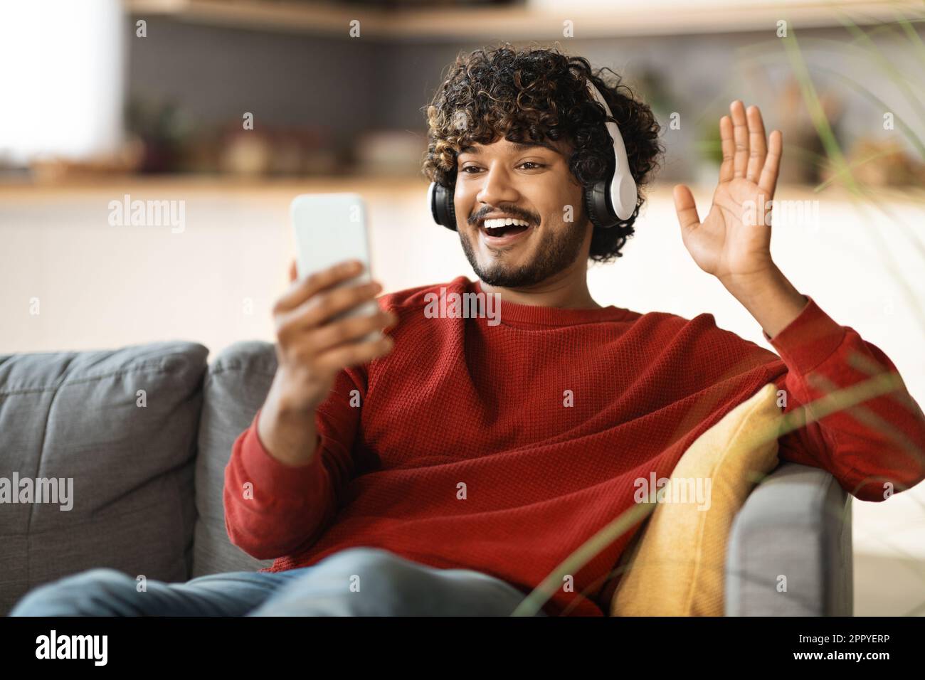 Online Communication. Happy Indian Guy Making Video Call Via Smartphone ...