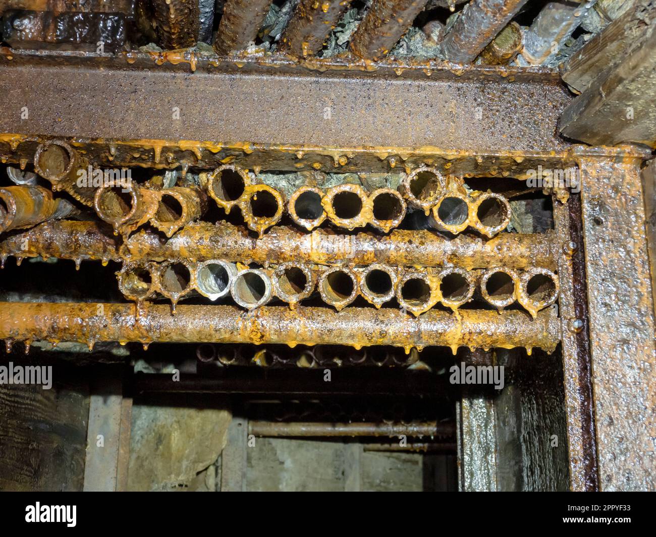 Scaffolding tube holding up the roof of an old abandoned copper mine in ...
