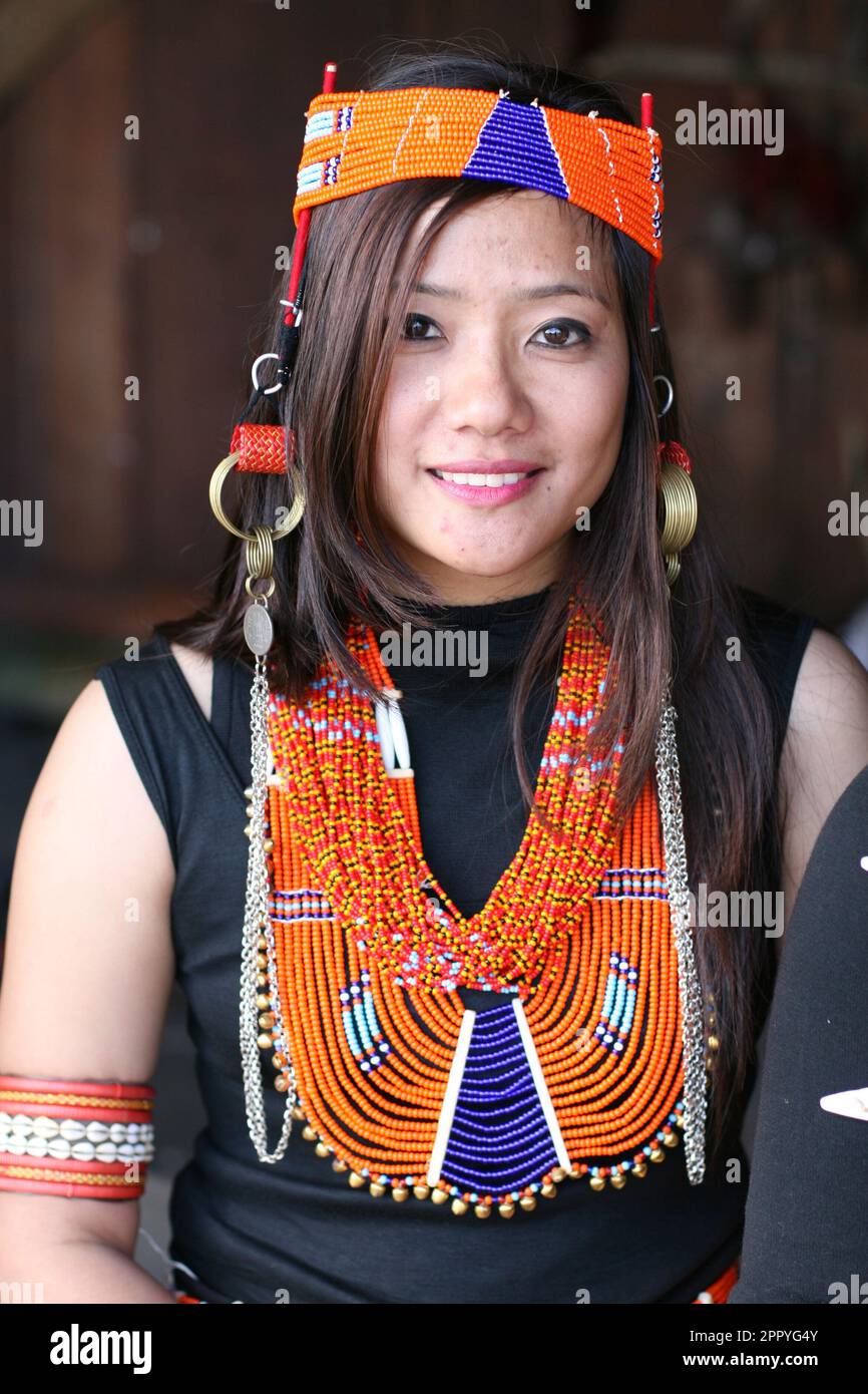 A beautiful Naga tribe lady fully adorned with colourful glass beads ...