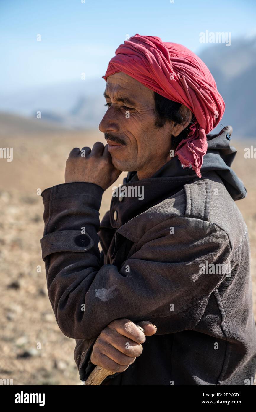 Portrait of a nomadic shepherd in the desert mountains around the Dades ...