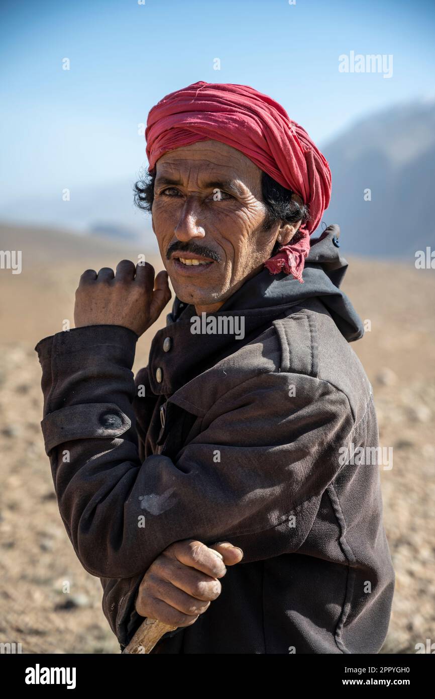 Portrait of a nomadic shepherd in the desert mountains around the Dades ...