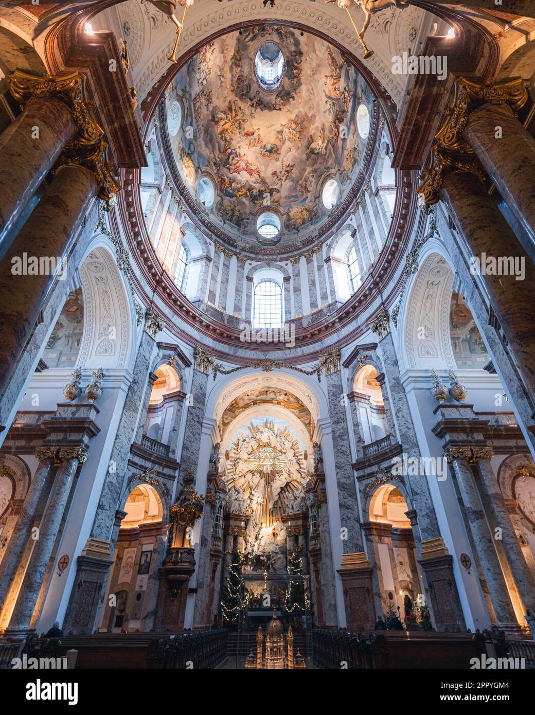 This interior shot of the Karlskirche cathedral features a magnificent ...