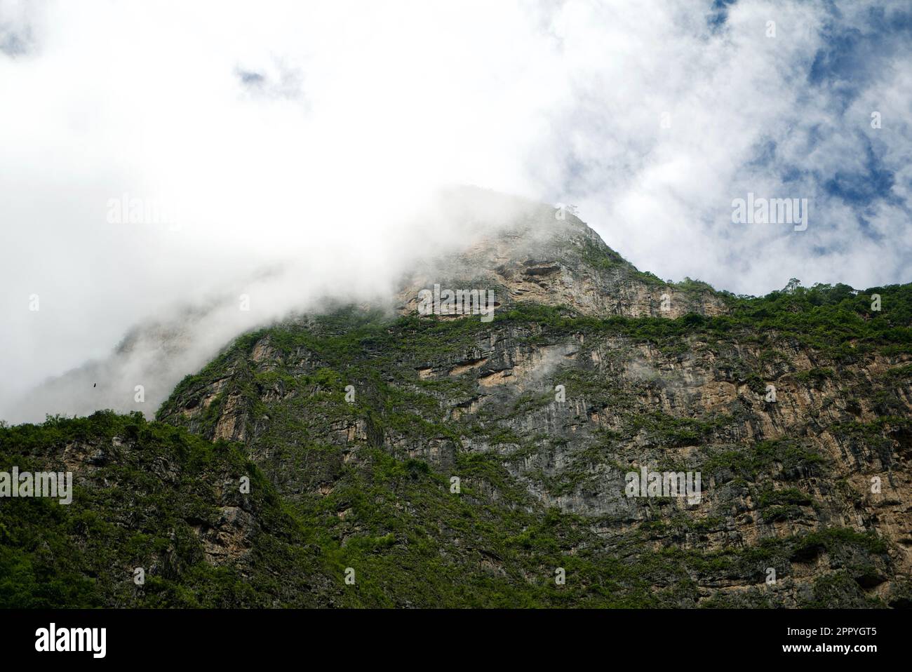 A majestic mountain landscape featuring an imposing mountain peak ...