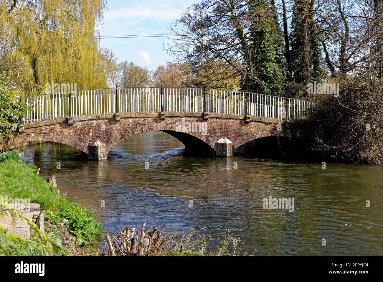 Red brick arched bridge with metal railing over the Avon river (Bristol ...
