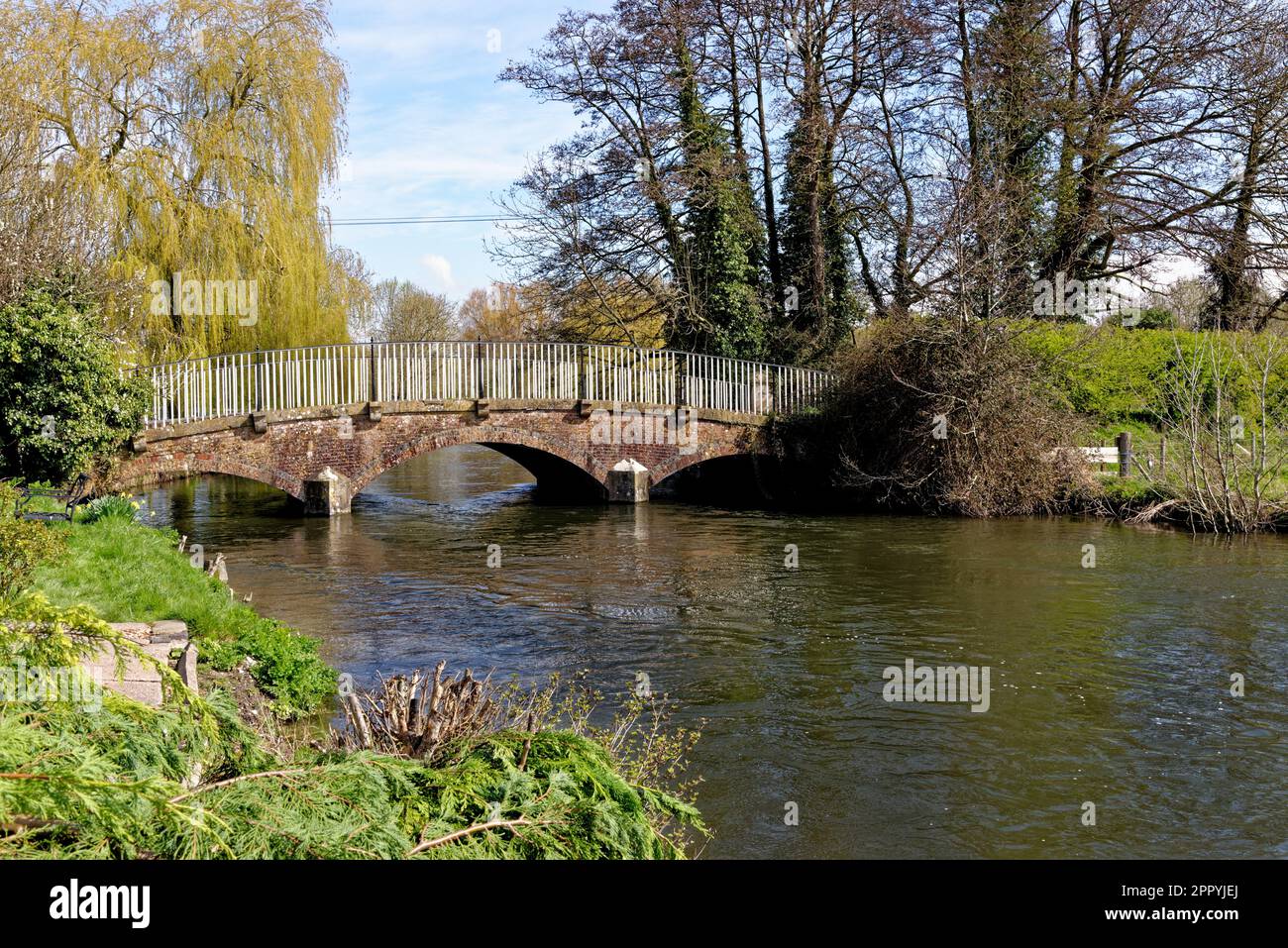 Red brick arched bridge with metal railing over the Avon river (Bristol ...