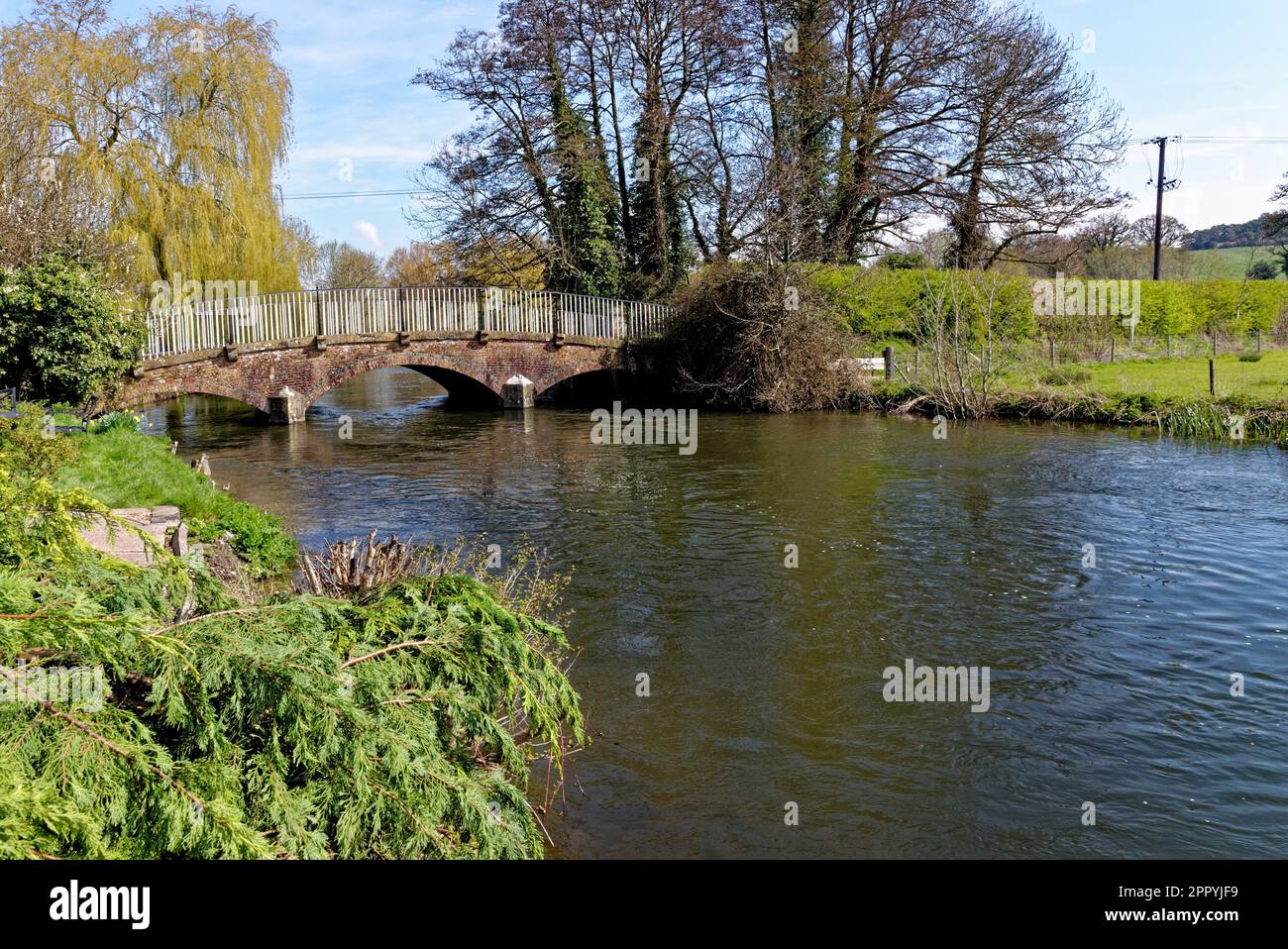 Red brick arched bridge with metal railing over the Avon river (Bristol ...