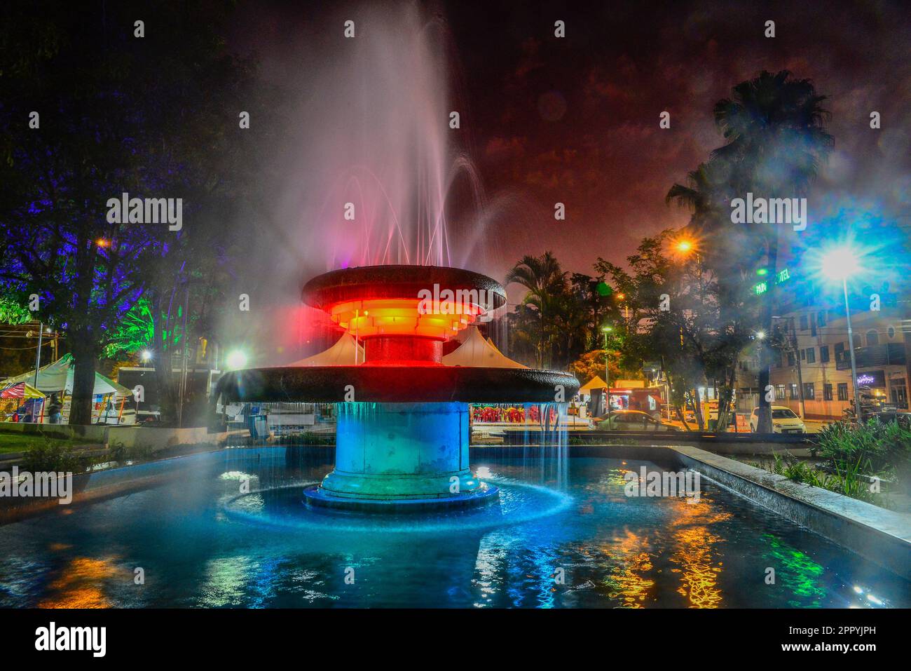 Iluminated fountain on the main square at Lambari town, one of the ...
