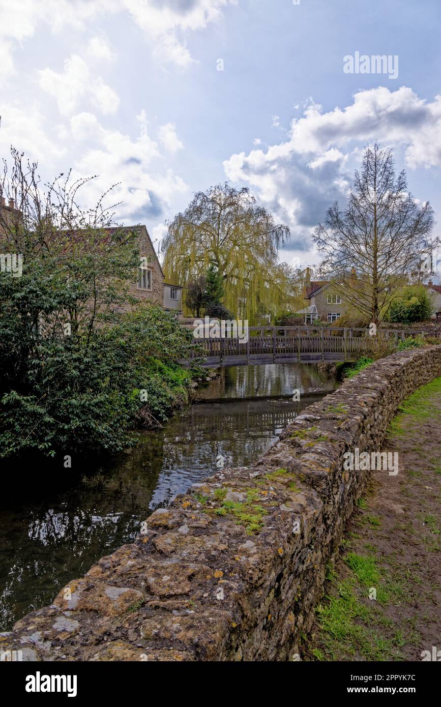 Pretty cottages and the Mells River at Nunney. Village of Nunney ...
