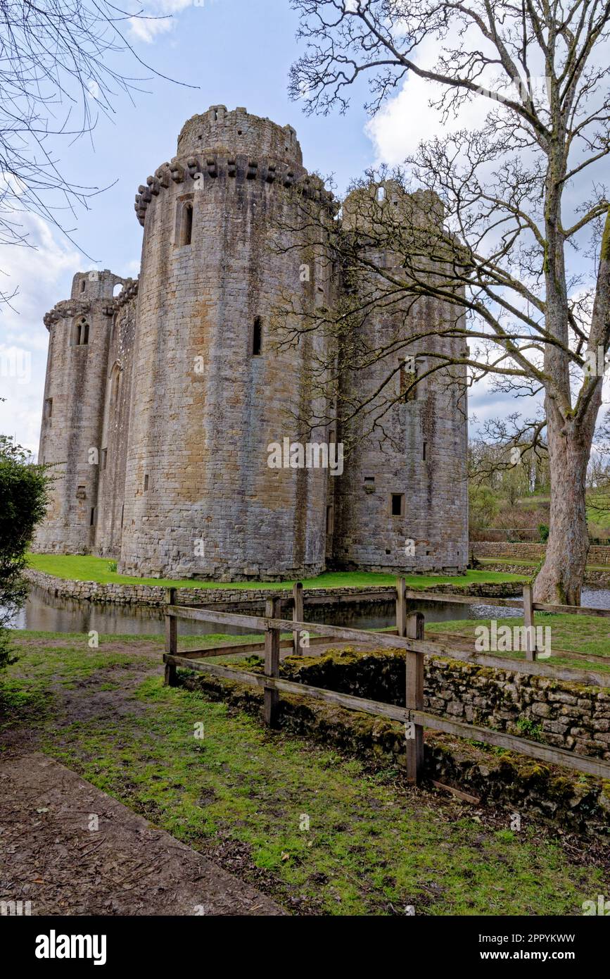 Nunney Castle and moat in the village of Nunney. Built in the 1370s by ...