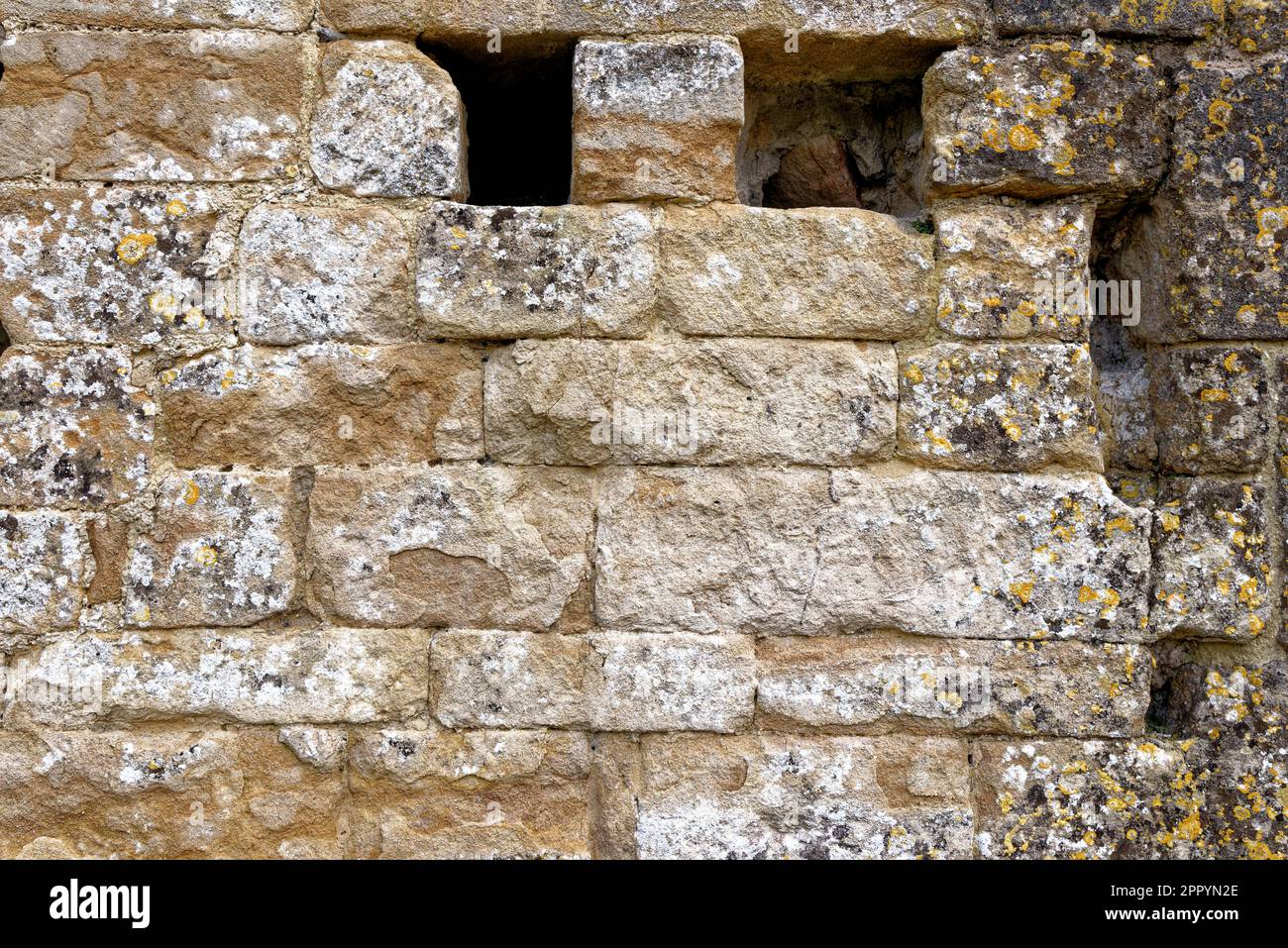 Masonry with different rock types - Closeup of bricks as part of old ...