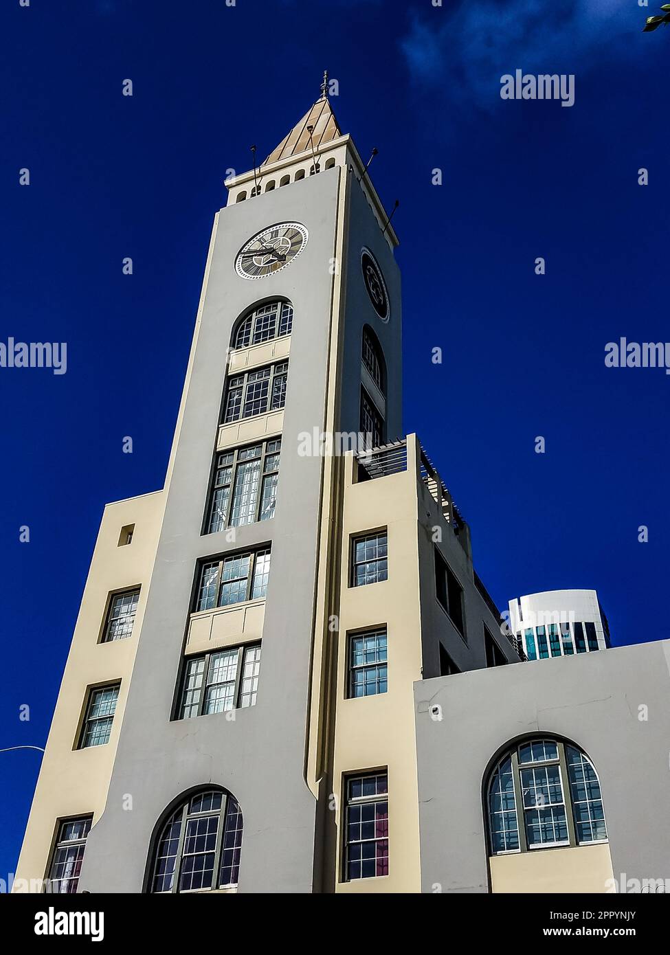 A majestic clock tower stands atop a grand building in San Francisco ...