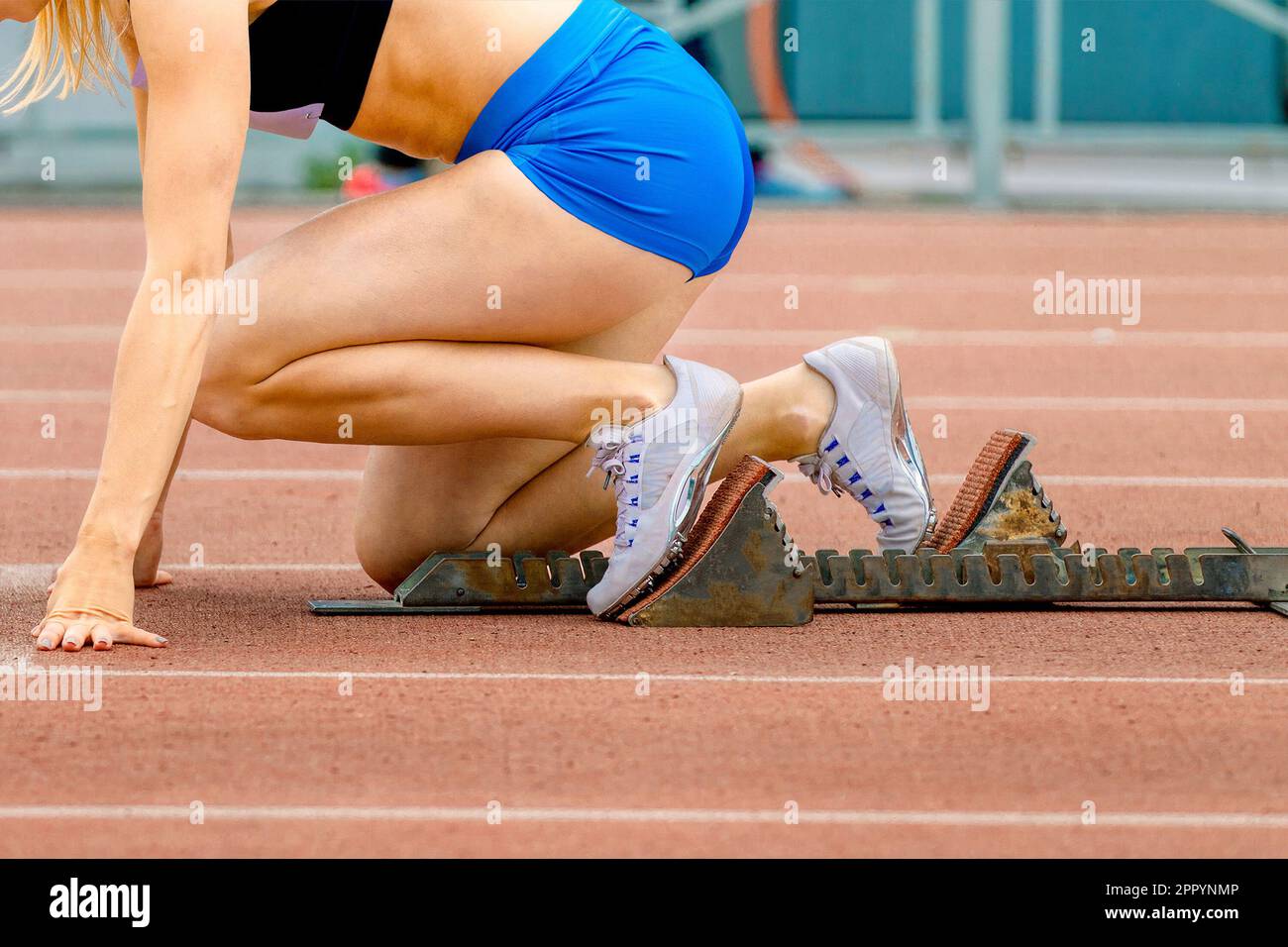 Female athlete in starting blocks hi-res stock photography and images ...