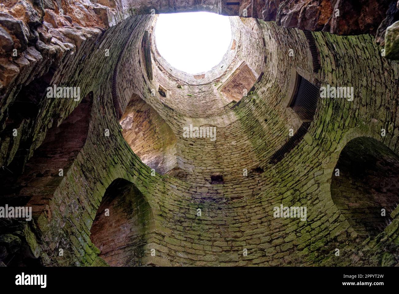 Inside walls of Nunney Castle and moat in the village of Nunney. Built ...