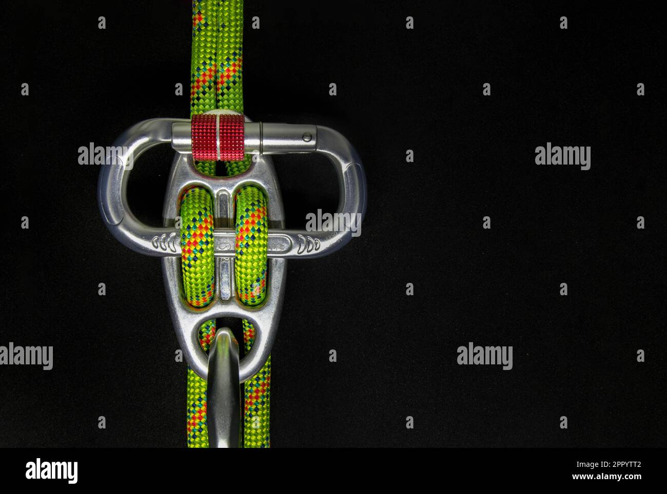 Gigi tag discensor with oval carabiner on a Black dark background in ...