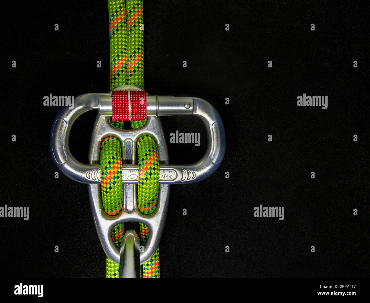 Gigi tag discensor with oval carabiner on a Black dark background in ...