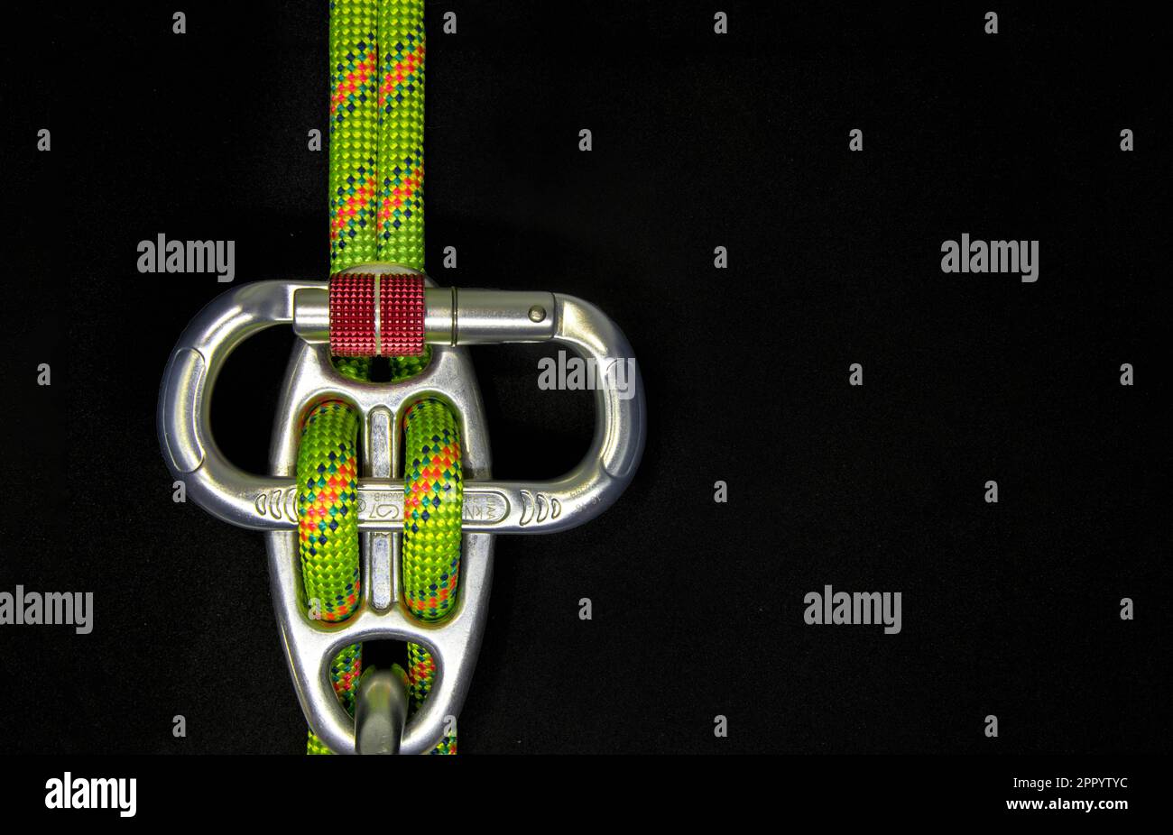 Gigi tag discensor with oval carabiner on a Black dark background in ...