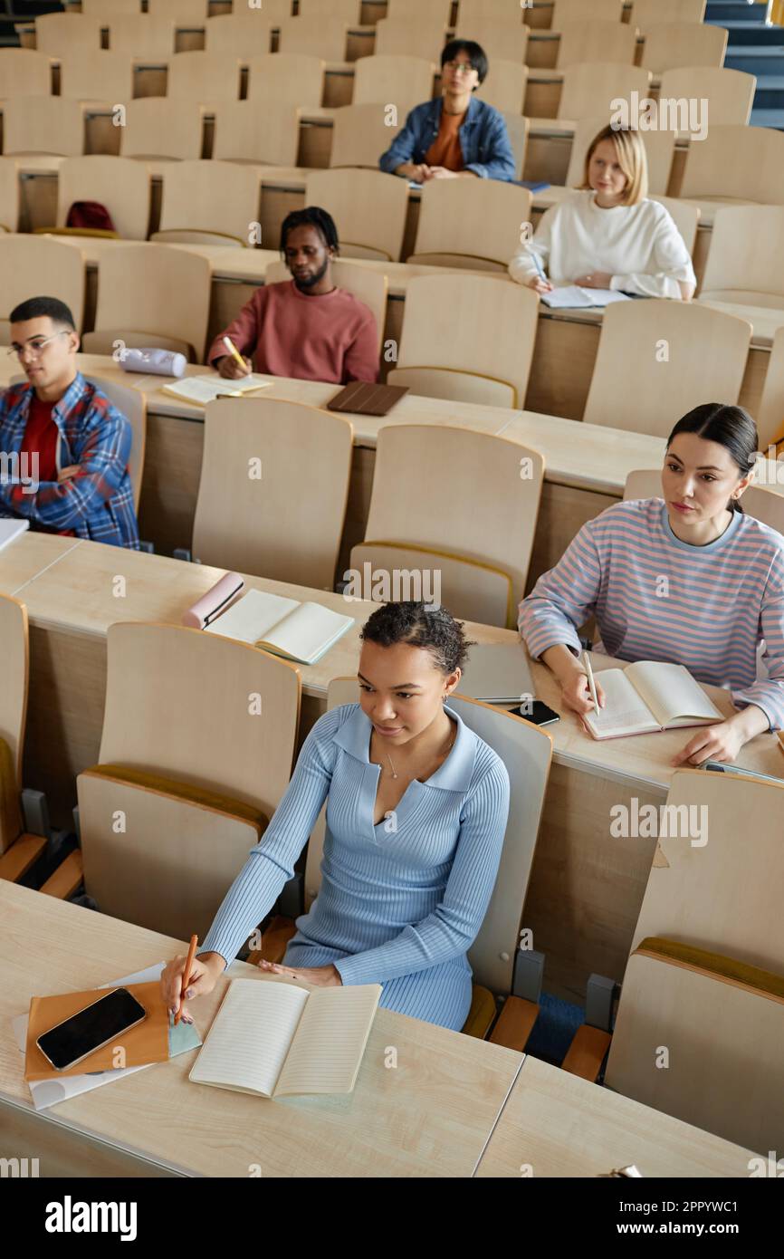 High angle view of group of students studying at lecture together at ...