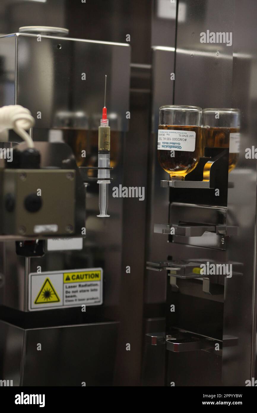 A filled syringe moves through the RIVA (Robotic IV Automation) , which ...