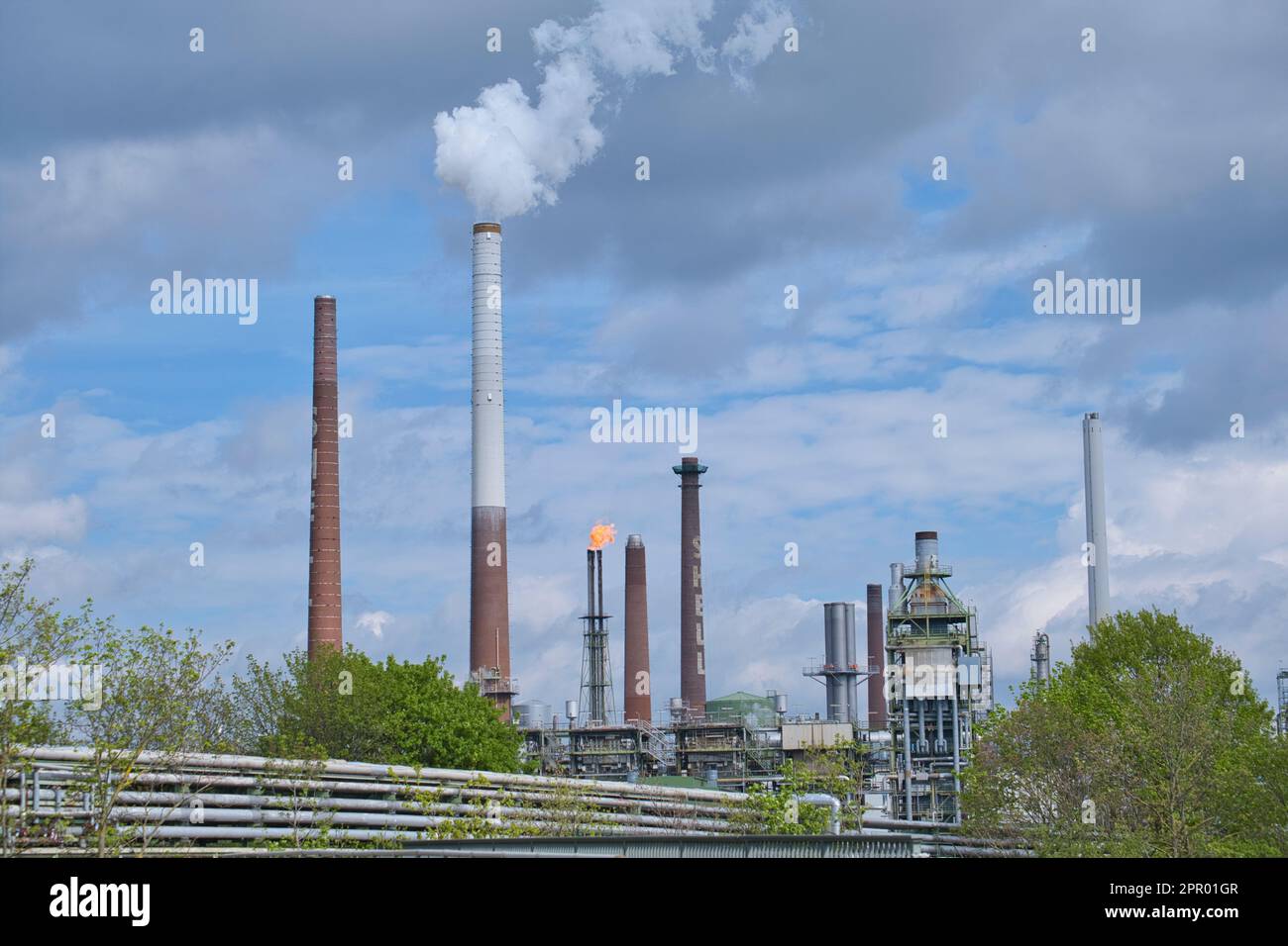 industrial plant, smoking chimneys , refinery of the Shell company ...