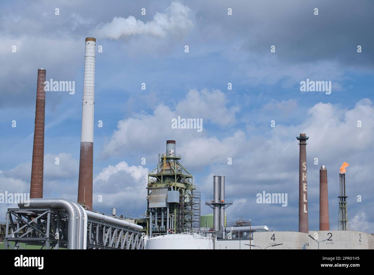 industrial plant, smoking chimneys , refinery of the Shell company ...