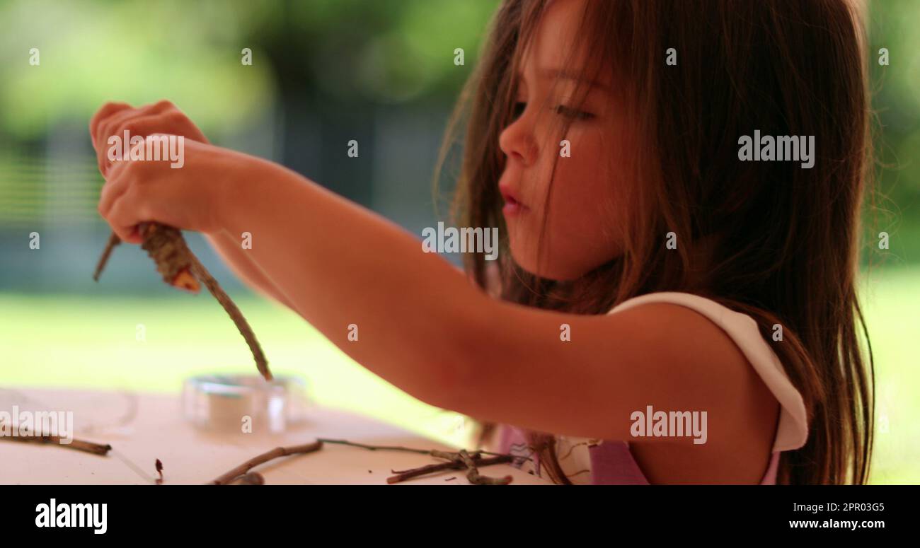 Creative little girl playing and crafting at home Stock Photo - Alamy
