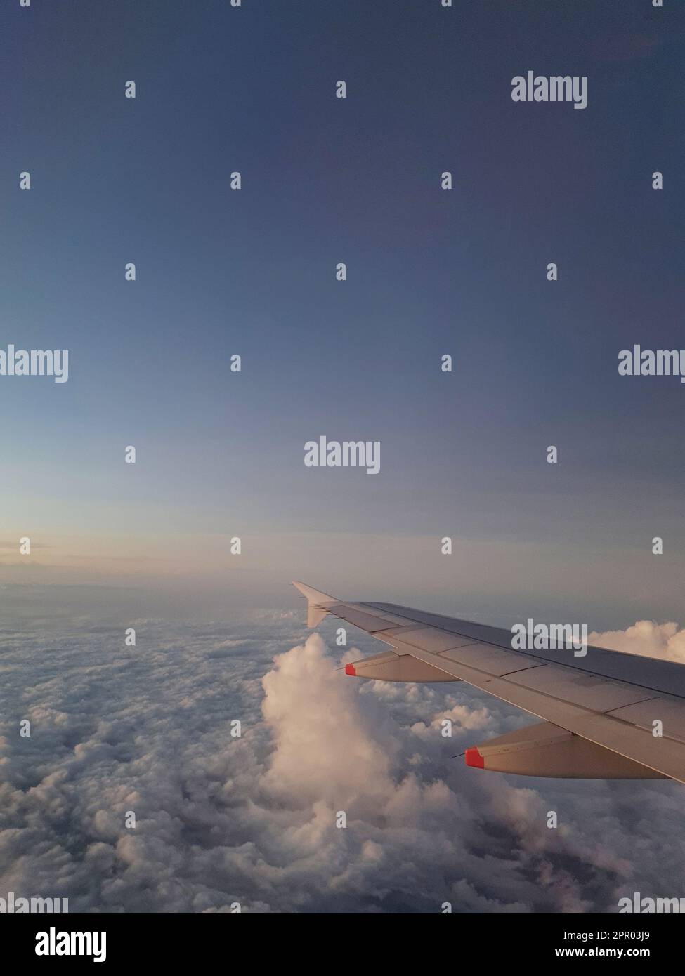 Blue clean sky with airplane wing from plane window Stock Photo - Alamy