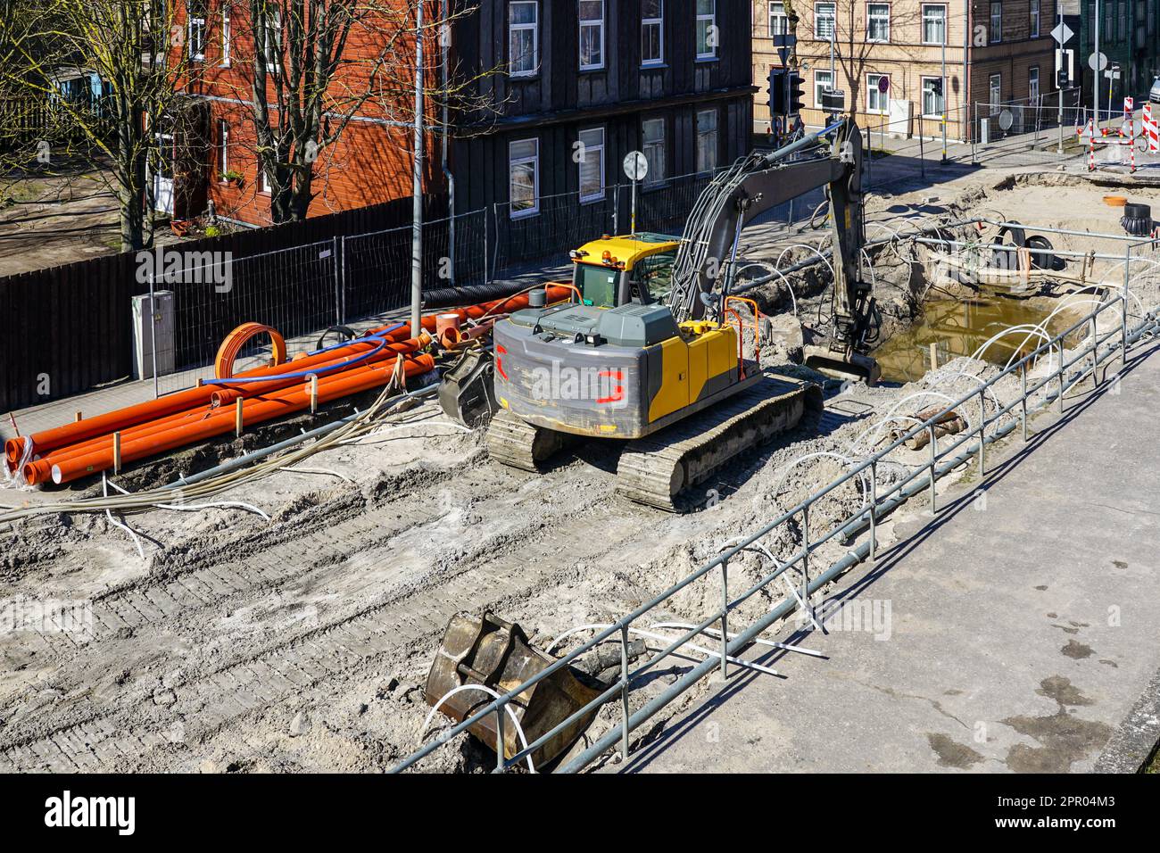 Underground pipeline replacement site with dewatering system on city ...