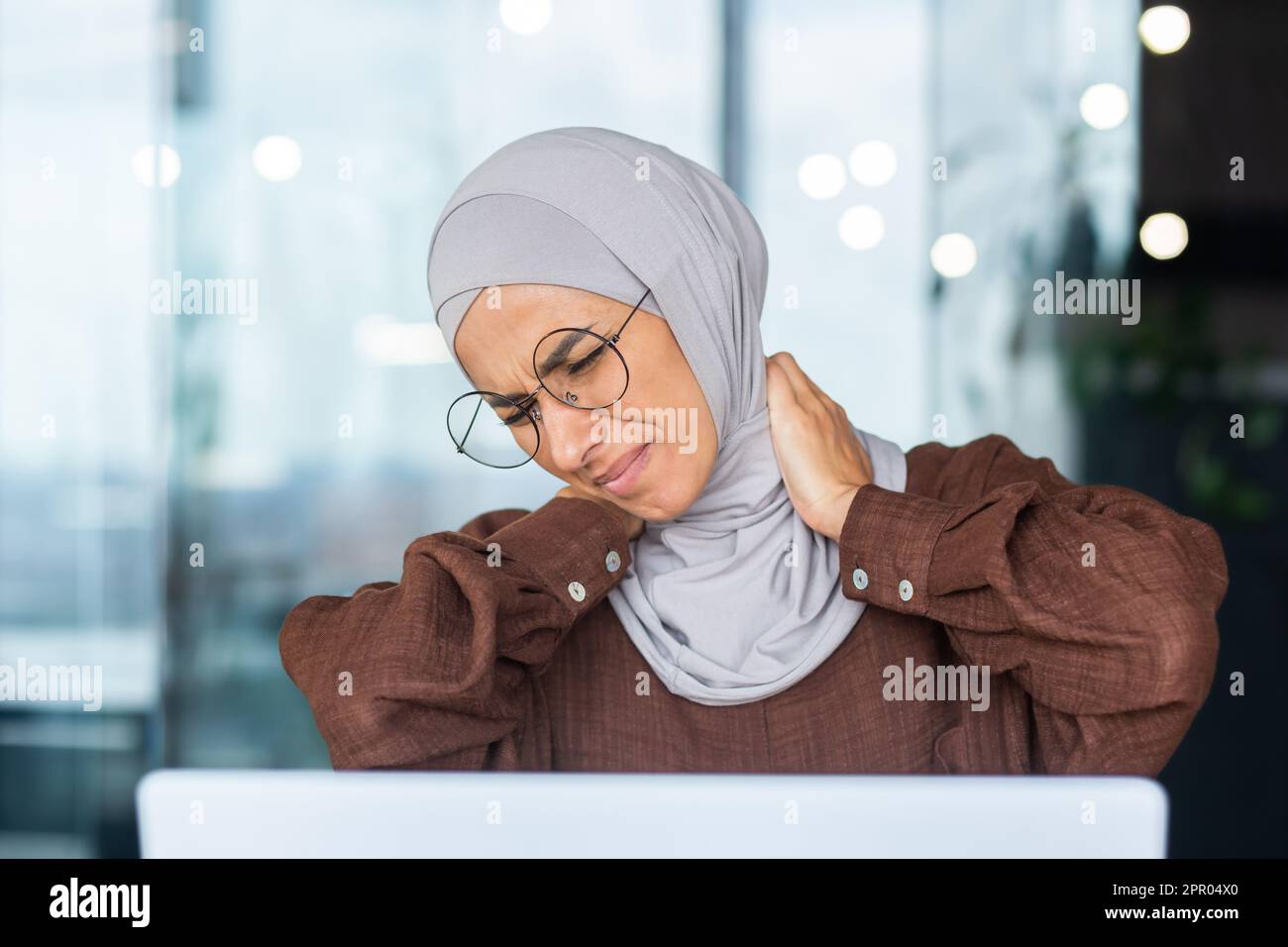 Close-up photo. Tired young arab woman in hijab student studying at ...