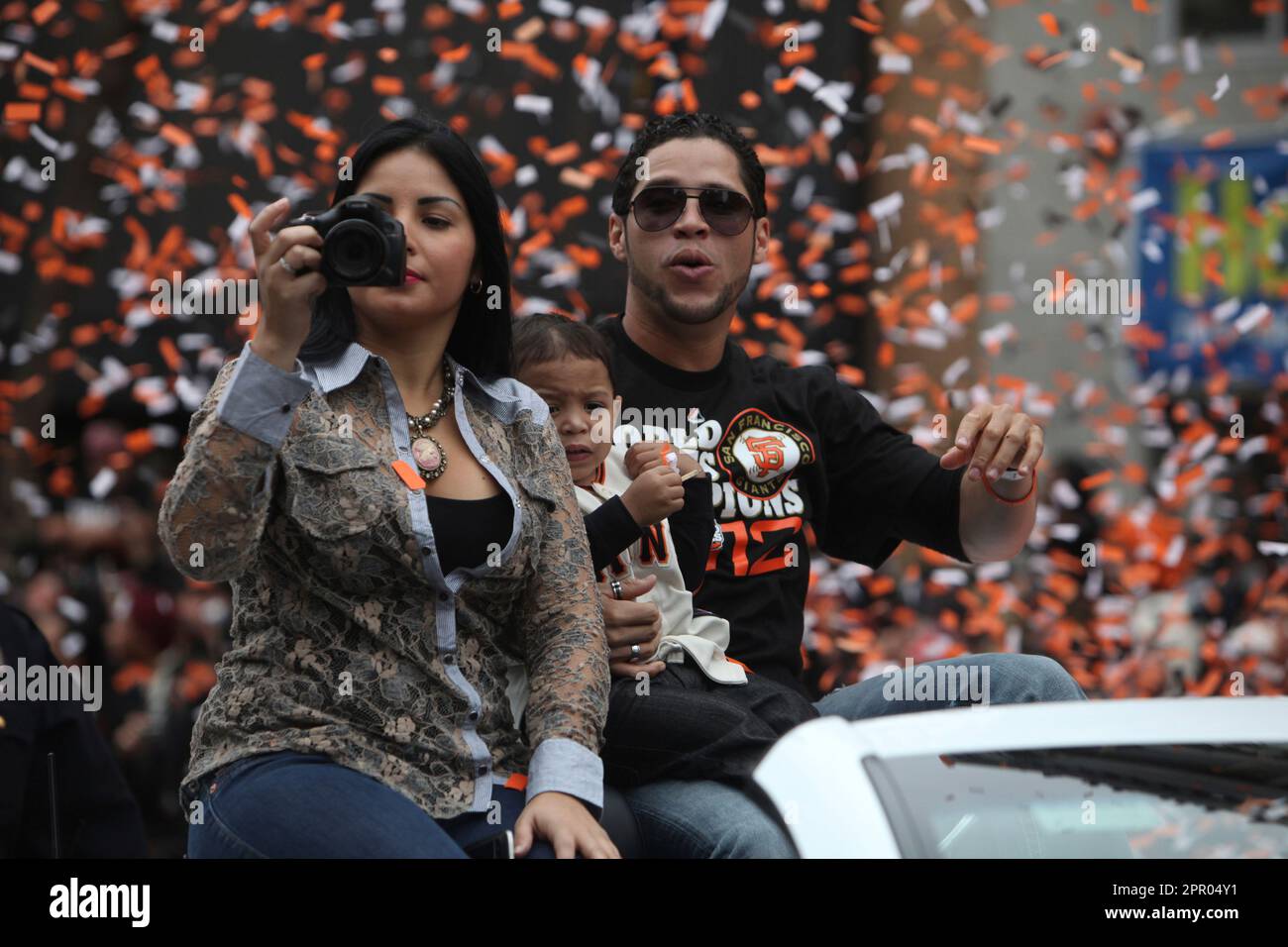 Gregor Blanco waves to fans as he rides along the parade route with his ...