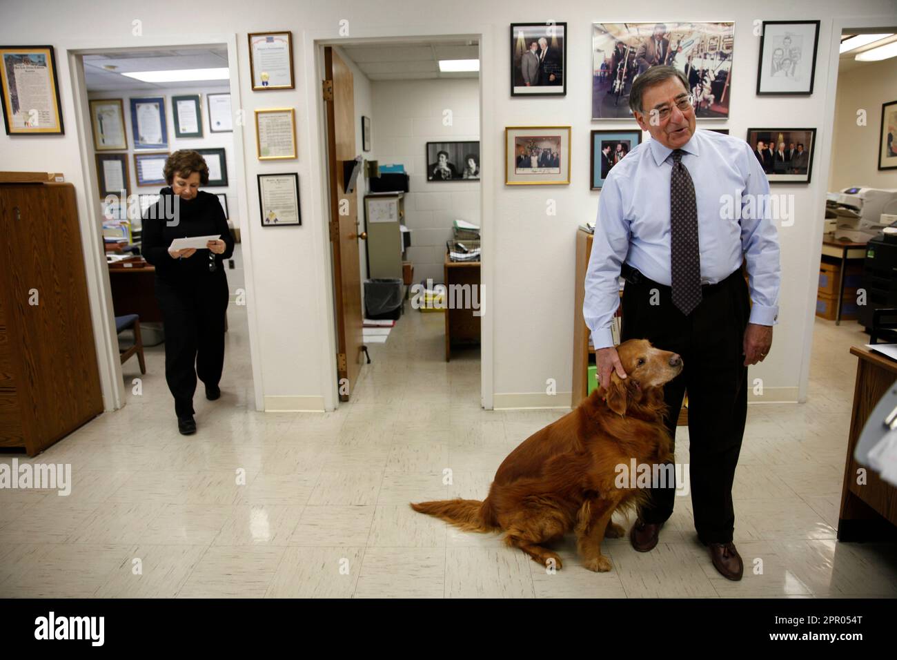 Former Defense Secretary Leon Panetta pats his dog Bravo as his wife ...