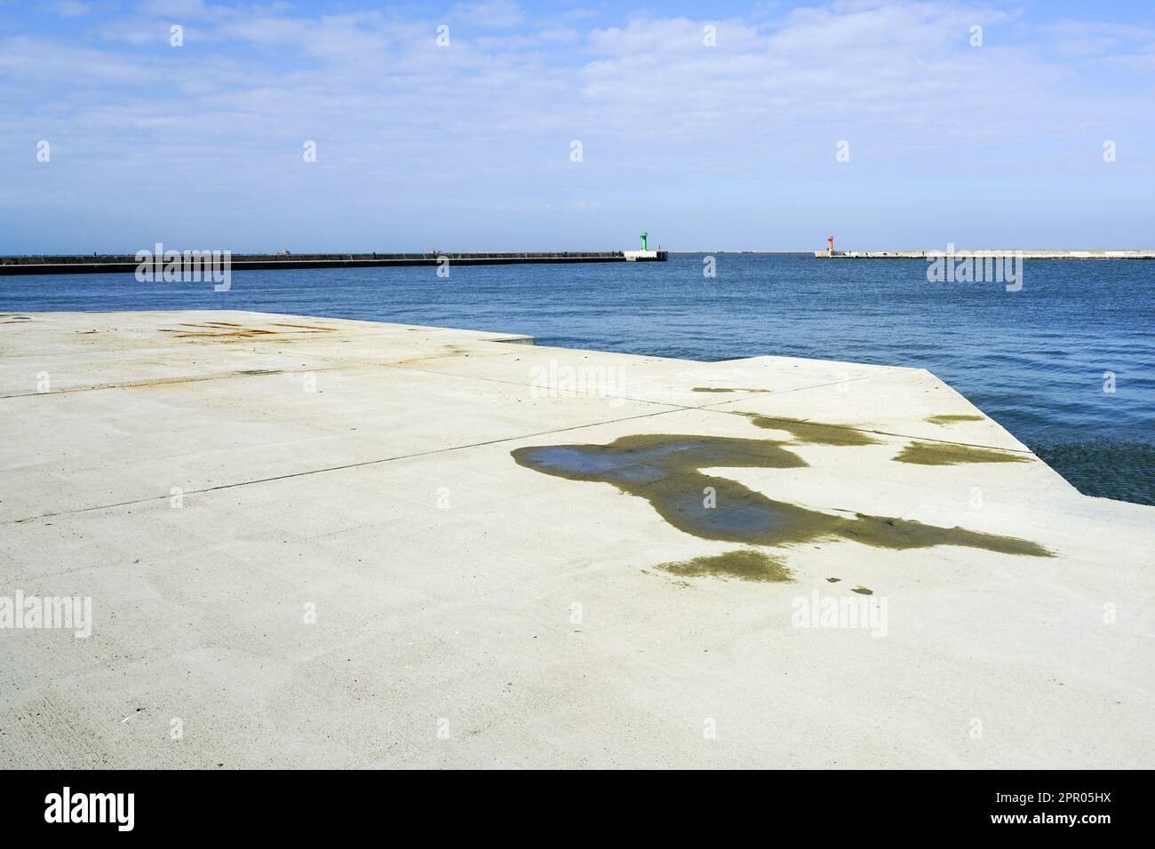 New reinforced concrete surface of the harbor pier, sea gate of the ...