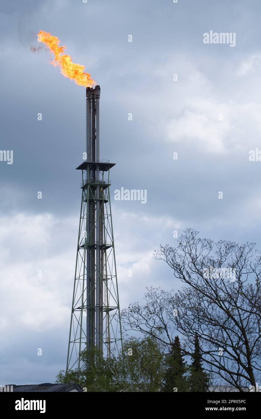 high chimney with brightly burning flame,flaring industry Stock Photo ...