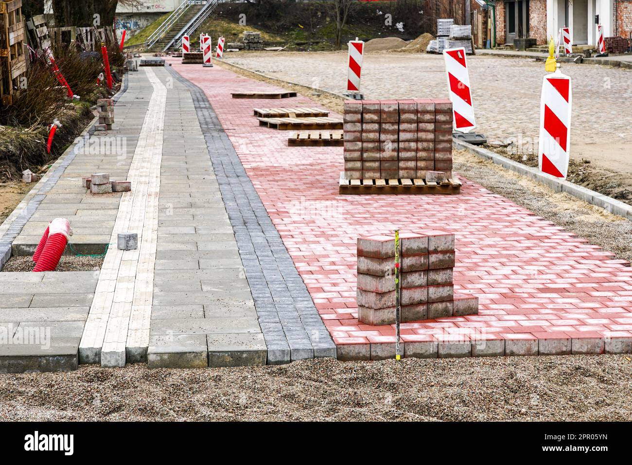 Paving of a new sidewalk with a bike lane and guidelines for the ...