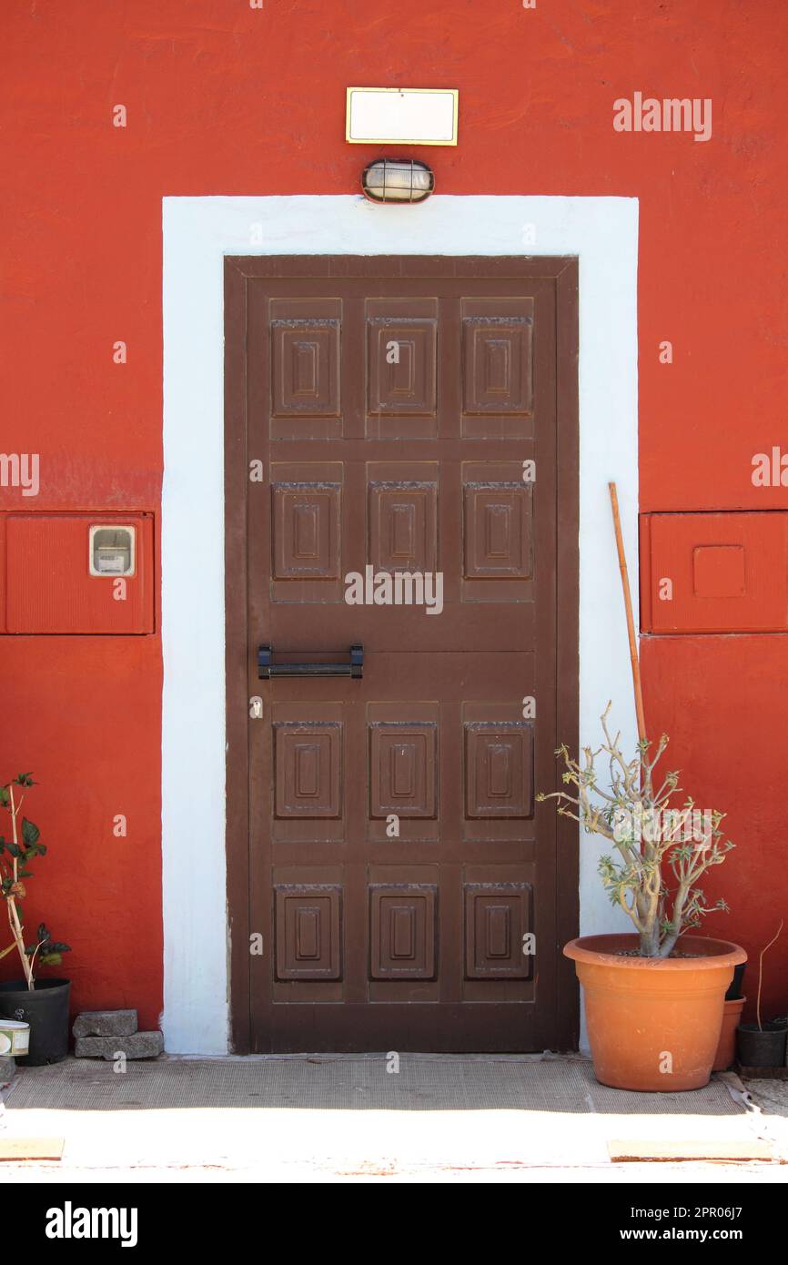 Ancient and colourful front door with flower pot Stock Photo - Alamy