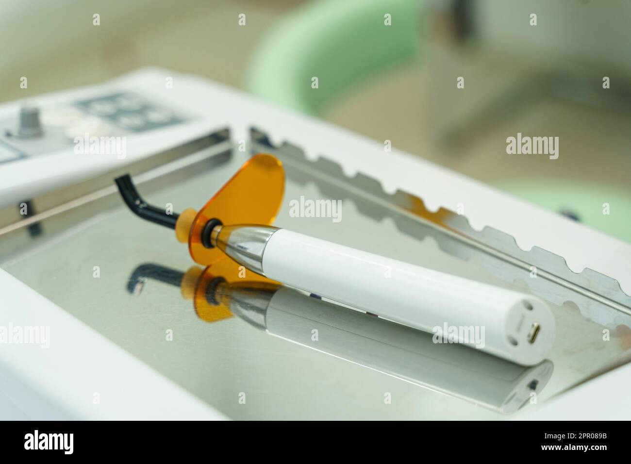 On the mirror surface lies a device for filling and drying teeth - a ...