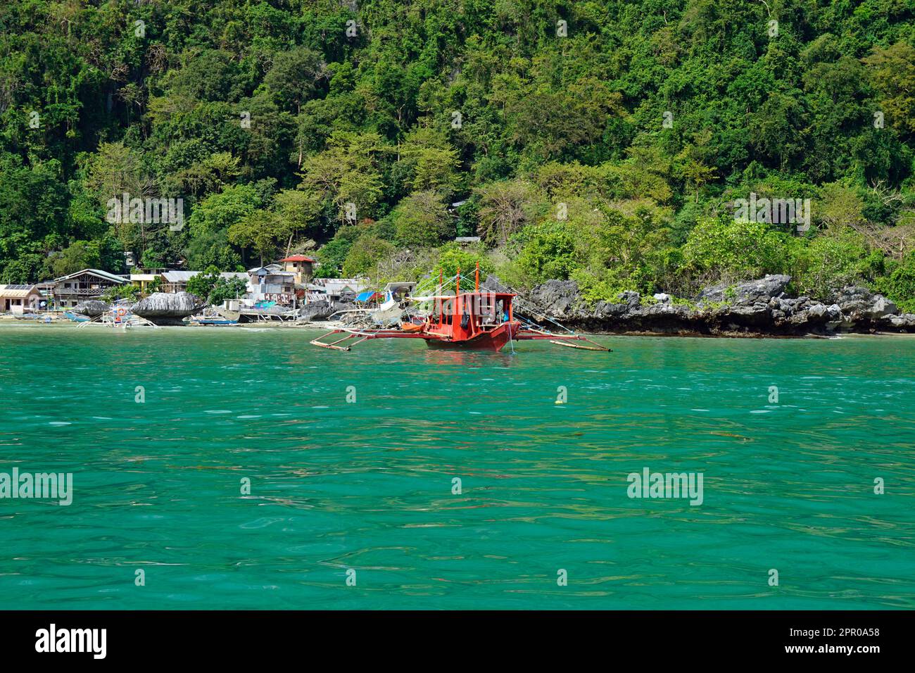 wooden traditional outrigger boats on palawan island at the philippines ...